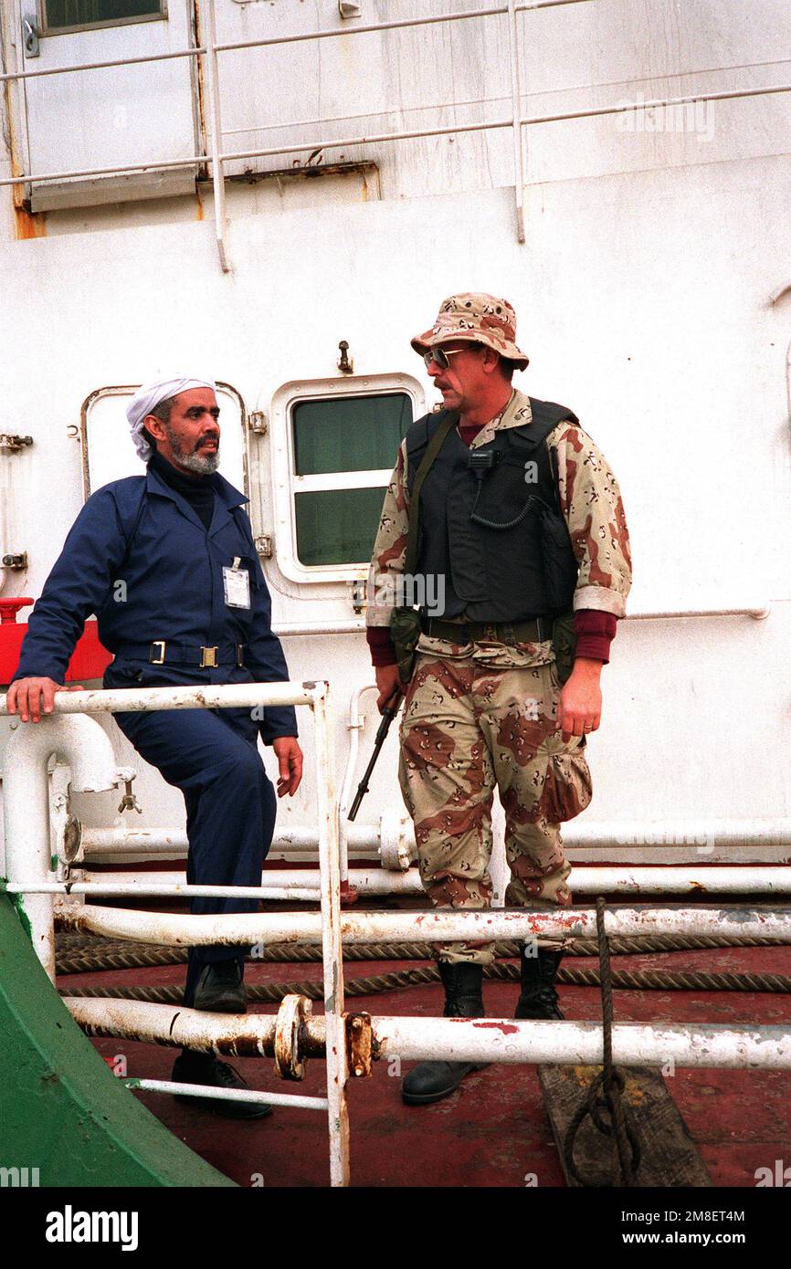 A Kuwaiti shipmaster speaks with LT. CMDR. Dave Wright, lead repair ...
