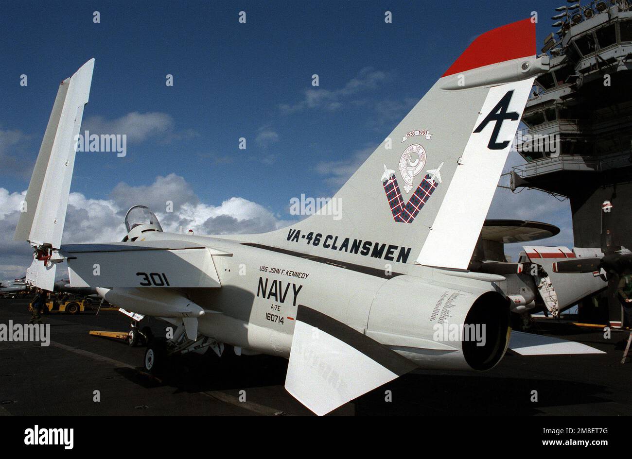 The squadron insignia adorns the tail of an A-7E Corsair aircraft ...