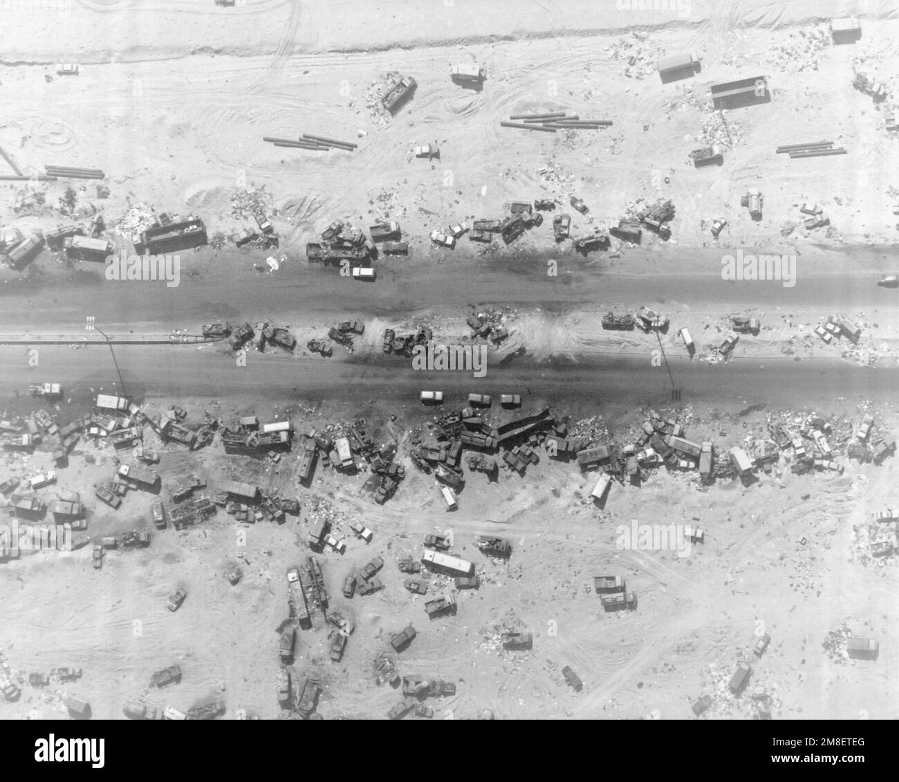 An aerial view of debris flanking the highway west of Kuwait City ...