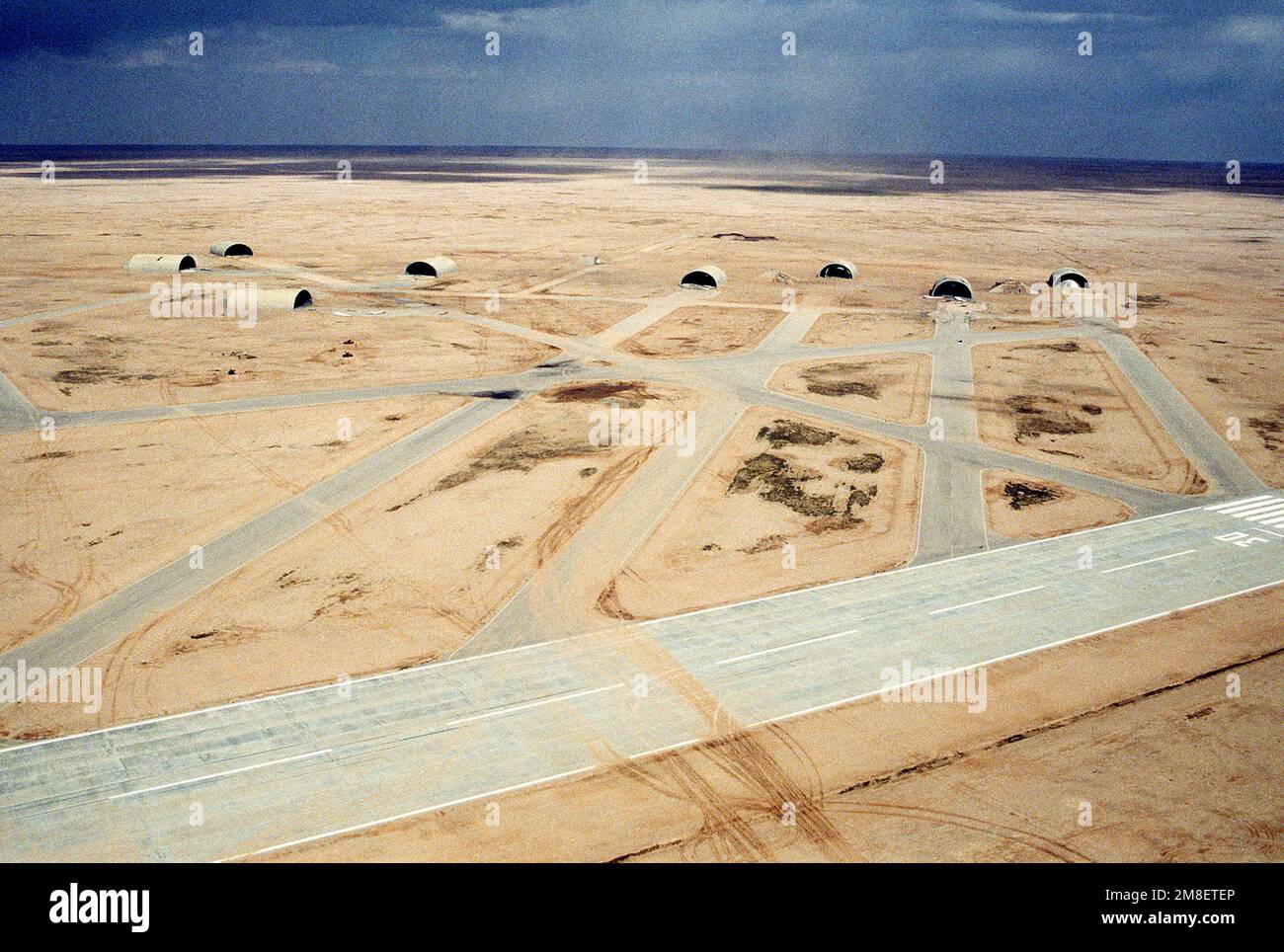 Destroyed concrete munitions bunkers and hardened aircraft shelters at ...