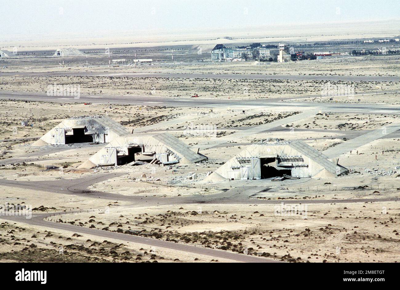 Iraqi hardened aircraft shelters damaged by Allied air strikes stand in ...