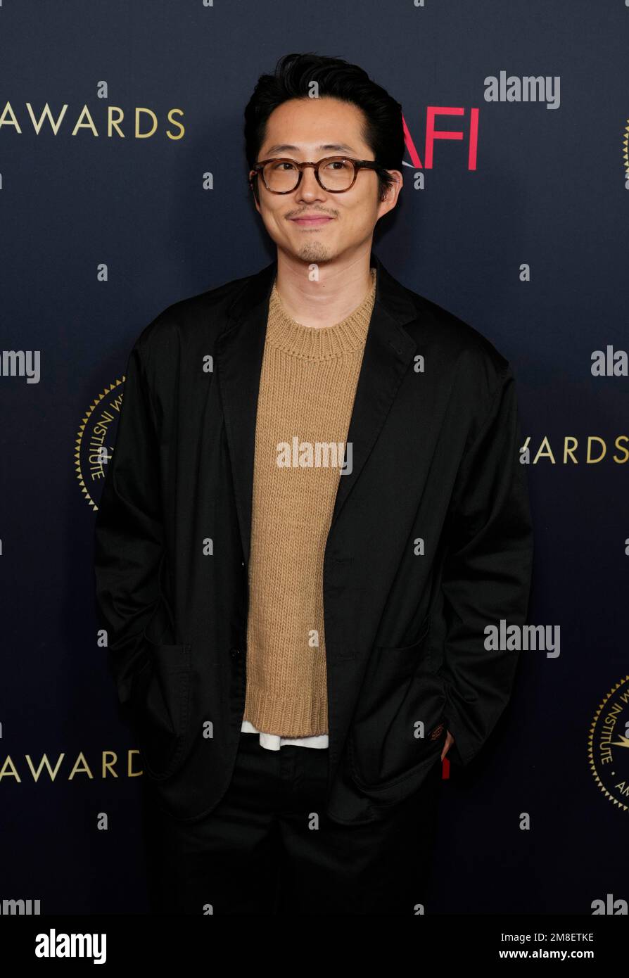 Actor Steven Yeun poses at the 2023 AFI Awards, Friday, Jan. 13, 2023 ...