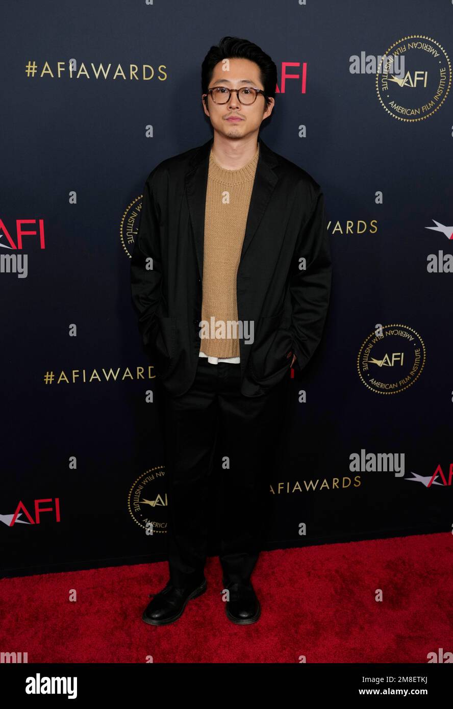 Actor Steven Yeun poses at the 2023 AFI Awards, Friday, Jan. 13, 2023 ...