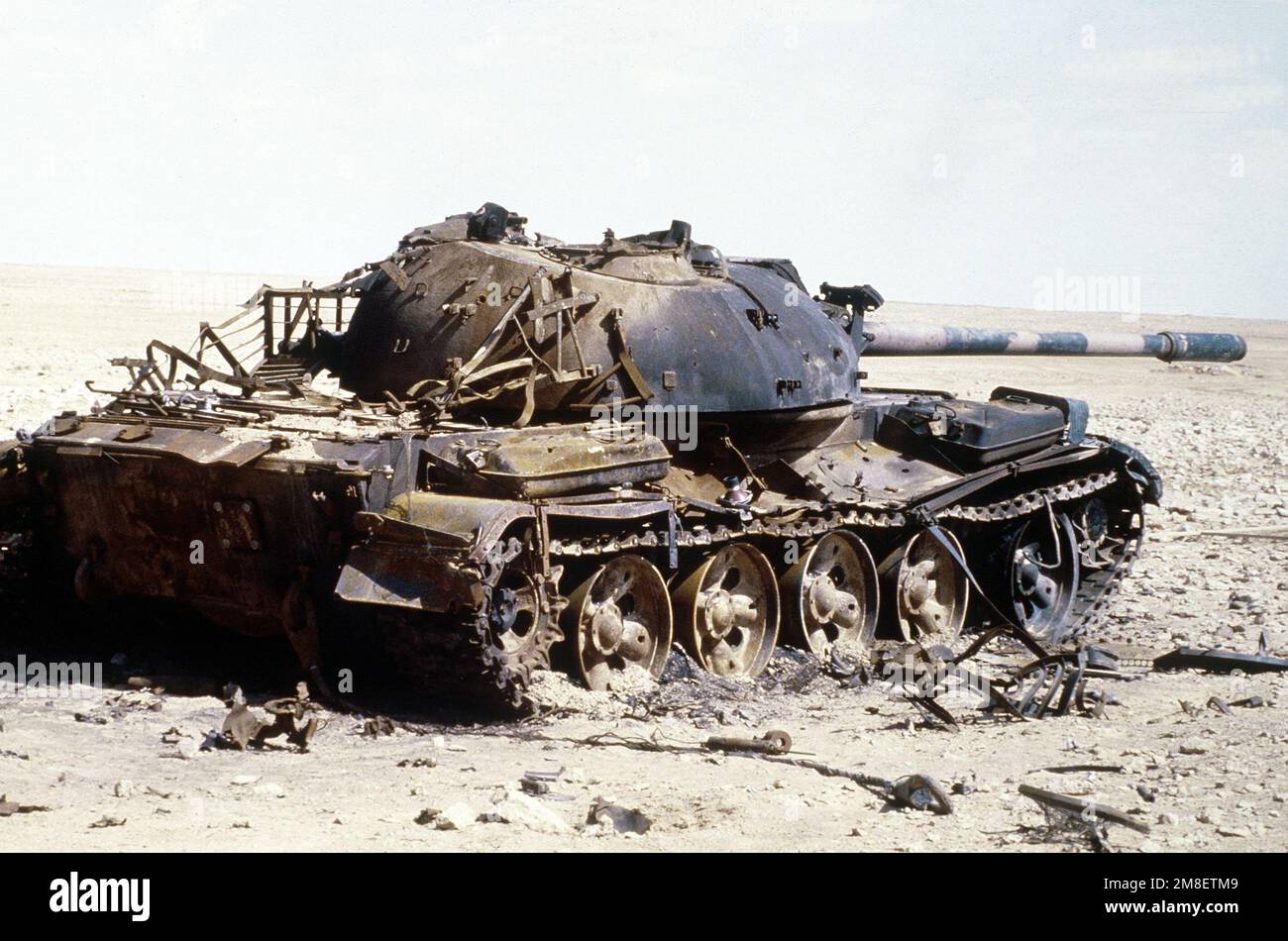 An Iraqi T-55 main battle tank lies in ruins after being destroyed by ...