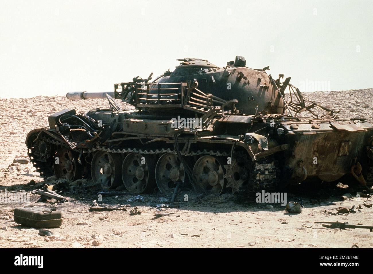 An Iraqi T-55 main battle tank lies in ruins after being destroyed by ...