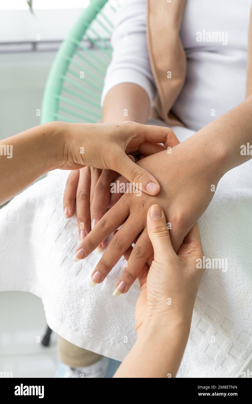 details of massage to the hands of a young person, texture of fingers ...