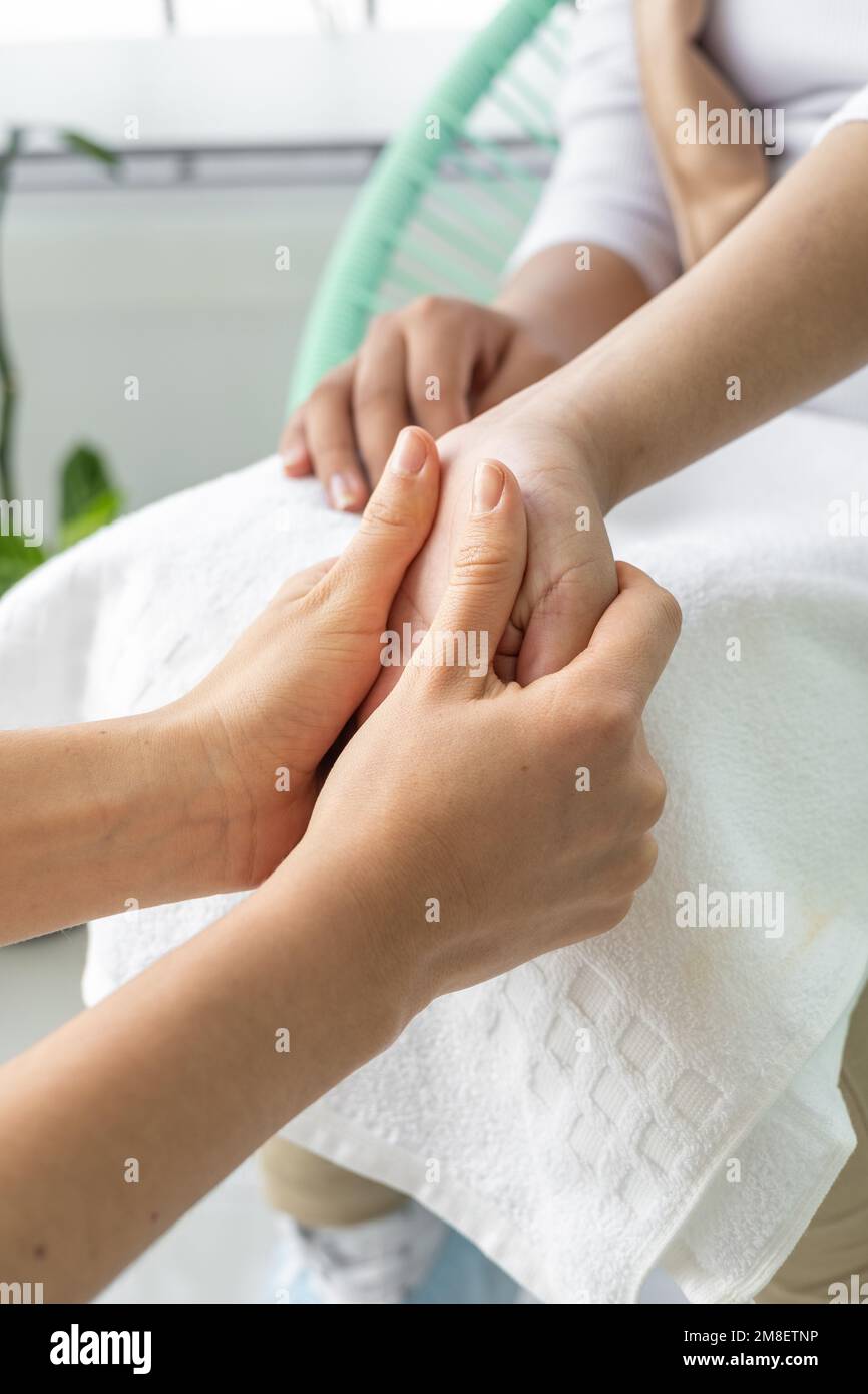 hands of a young person, texture of fingers and joints while getting a ...