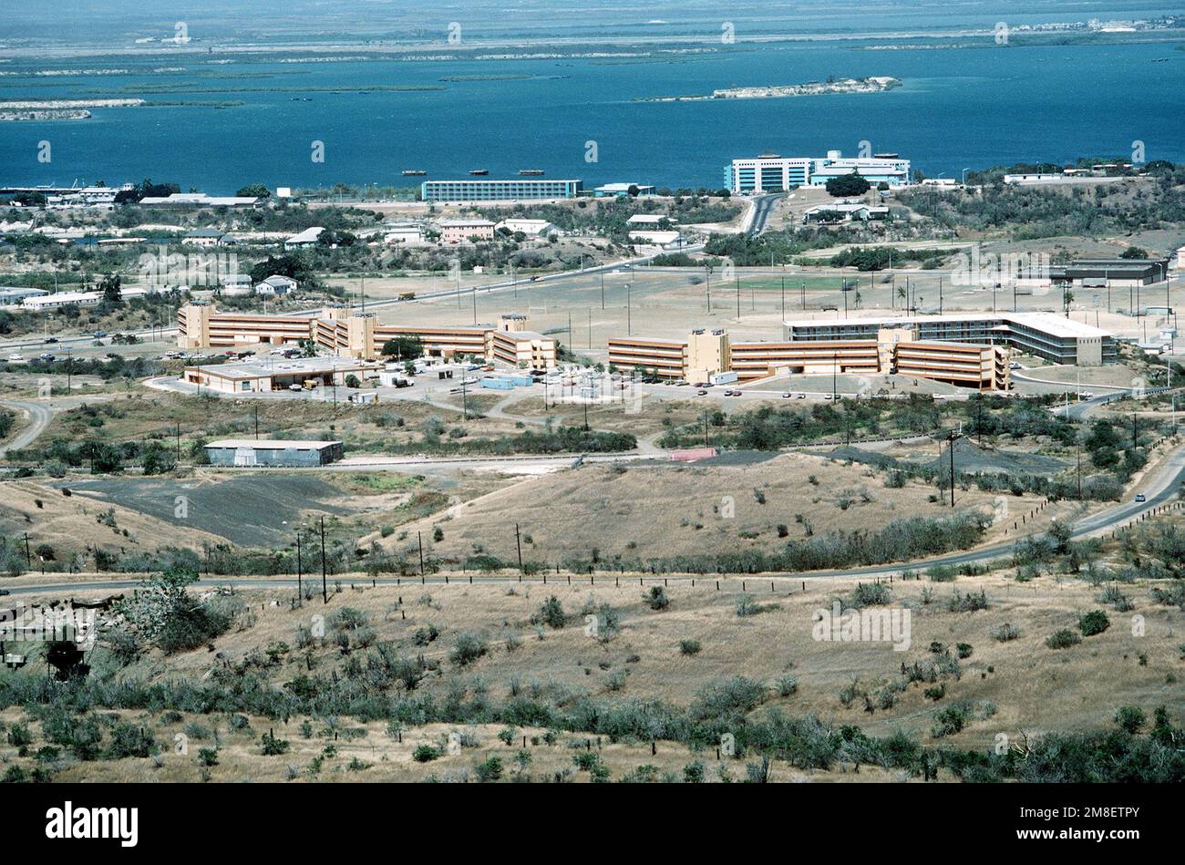 A view of a portion of the naval station. The buildings at center are ...