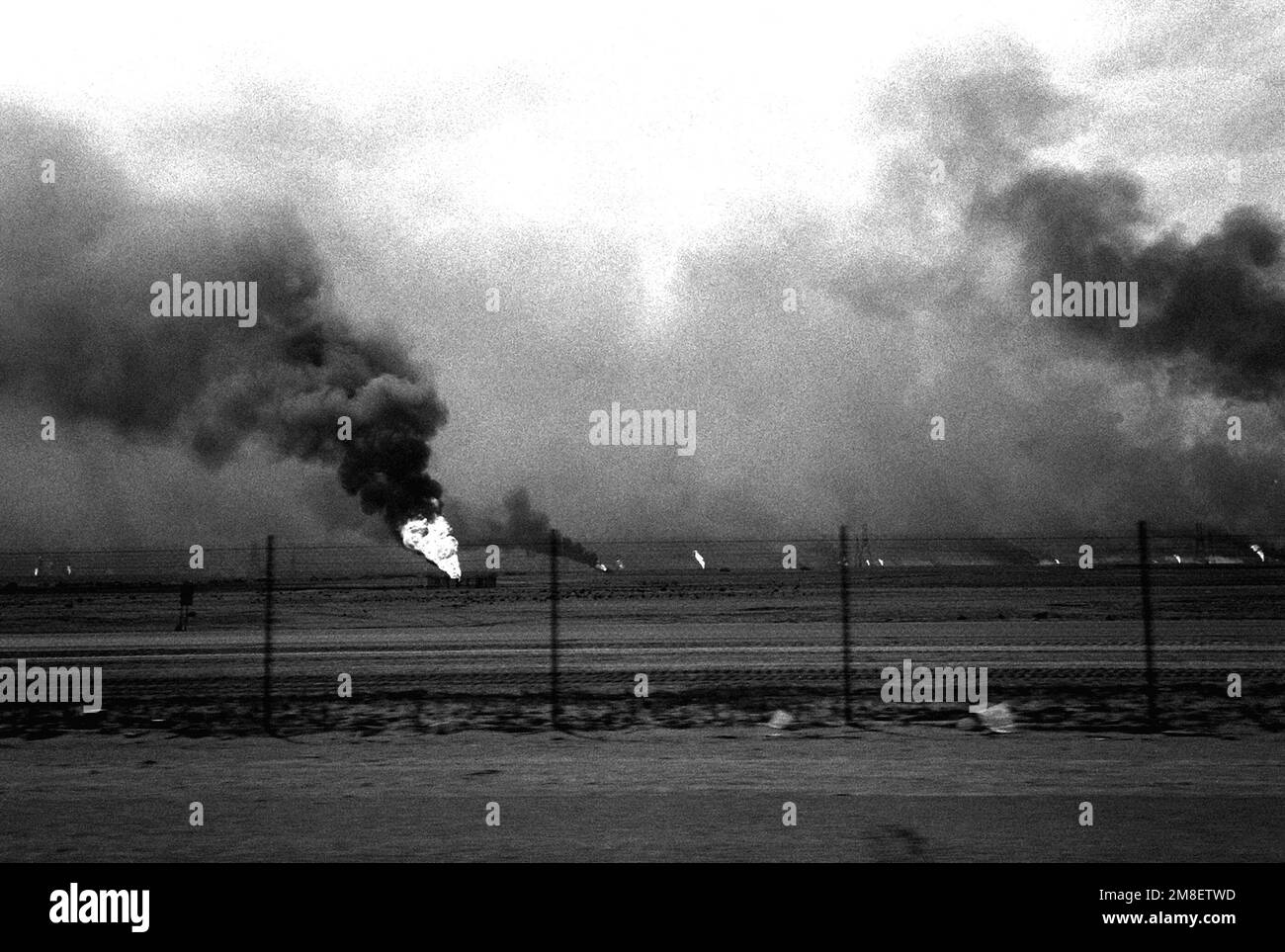 Oil well fires set by retreating Iraqi troops burn in the desert ...