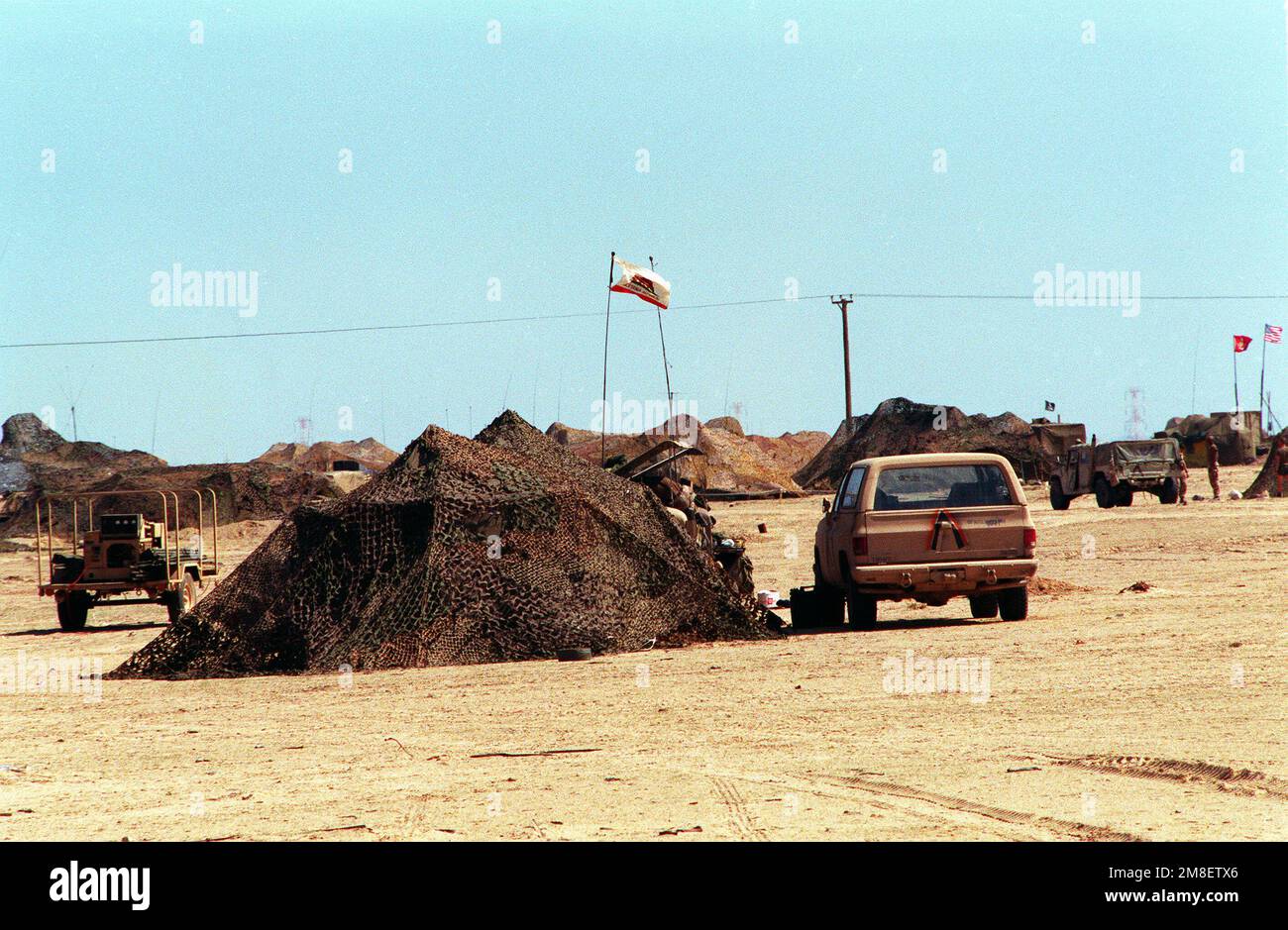 Camouflage covers a U.S. Army psychological operations facility next to ...