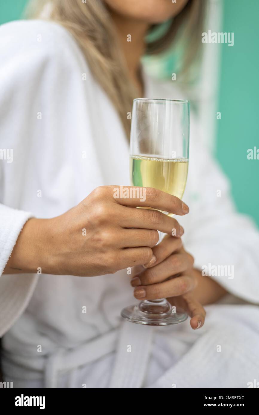 hand holding a glass goblet with a champagne drink, celebration and ...