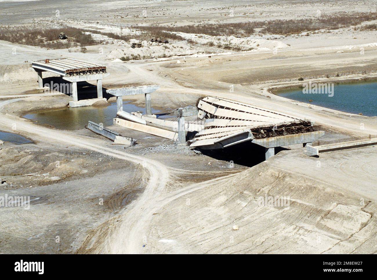 A partially completed bridge destroyed during Operation Desert Storm ...