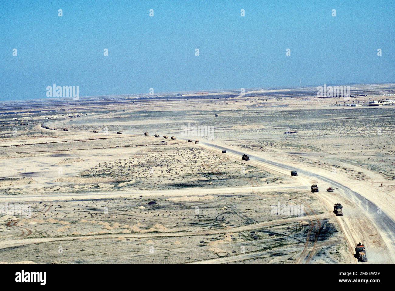 A column of vehicles of the 3rd Armored Regiment moves into the ...