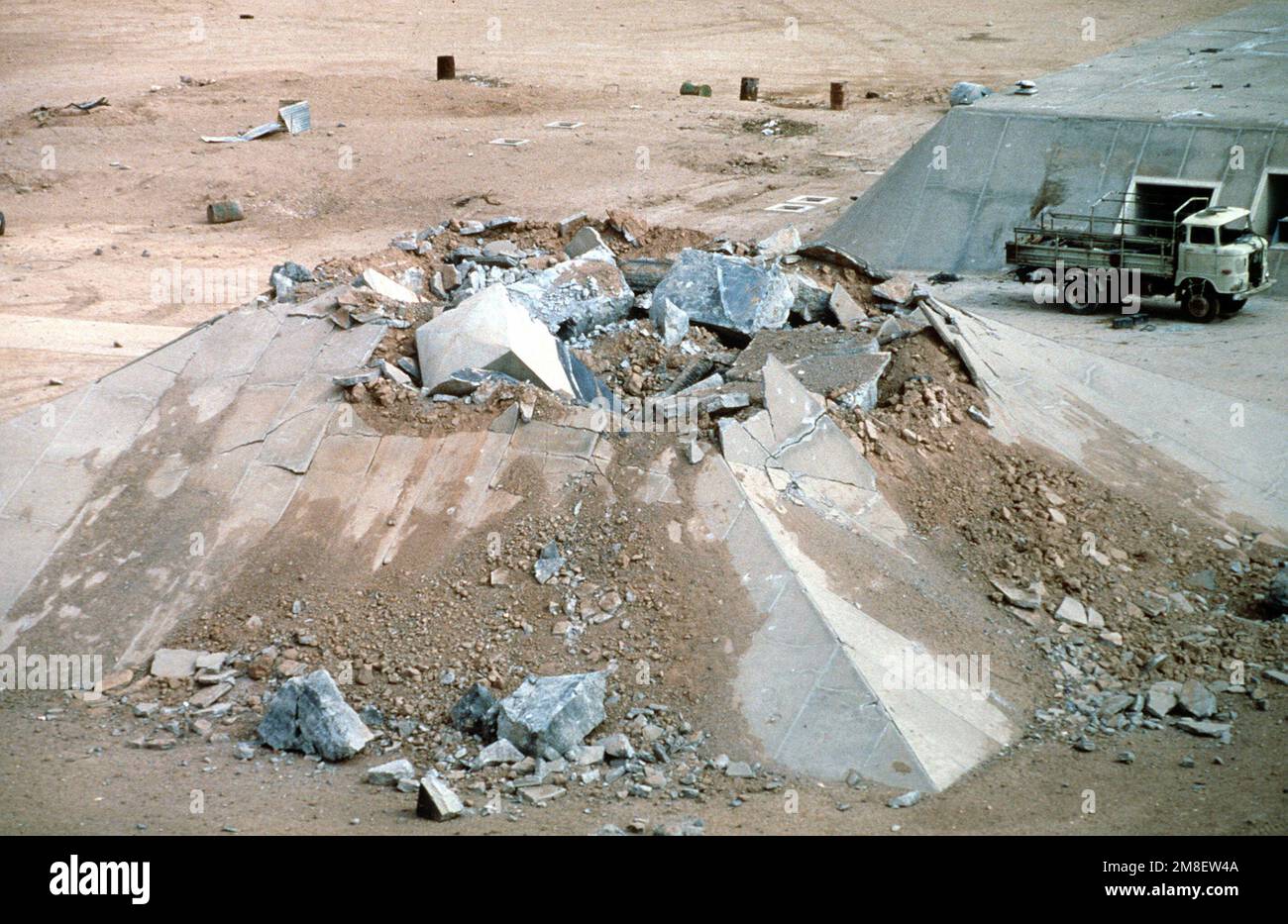An Iraqi munitions bunker lies in ruins after it was hit in an Allied ...