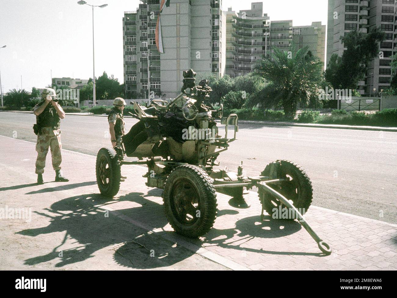 Two American soldiers check out an abandoned Iraqi ZPU-4 14.5mm anti ...