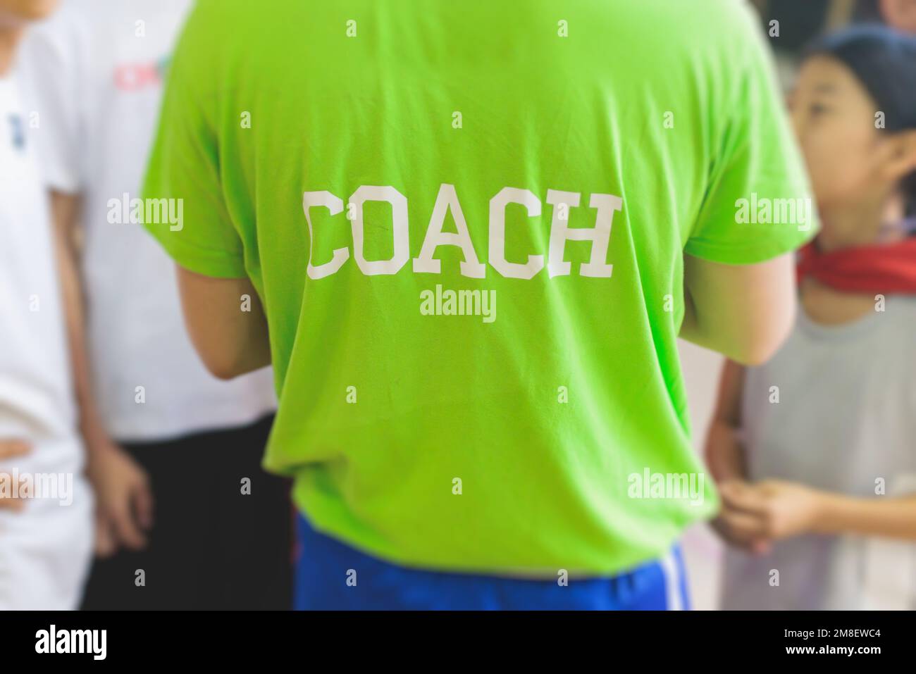 Junior young basketball team with a coach, group of kids children team ...