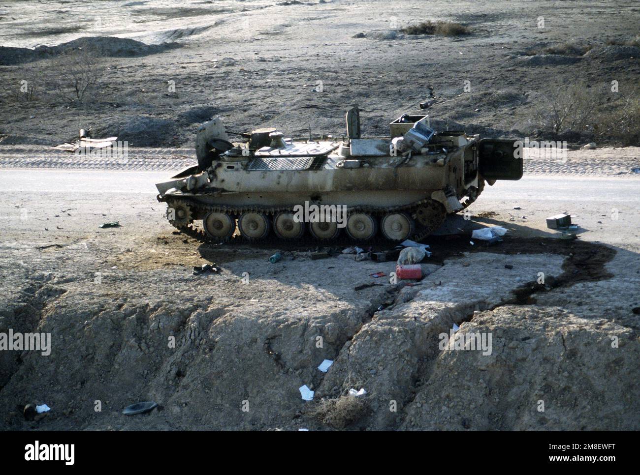 An Iraqi MT-LB armored personnel carrier damaged in the Euphrates River ...