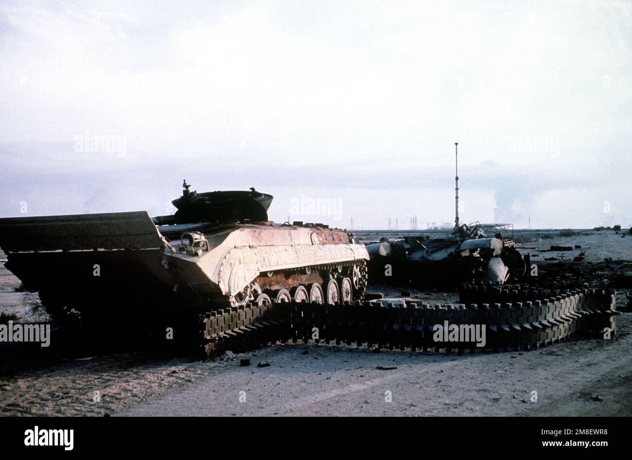 A demolished Iraqi BMP-1 infantry fighting vehicle and a demolished ...