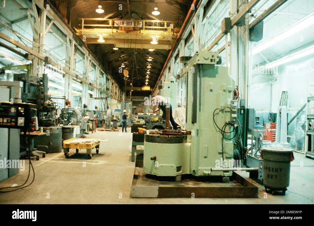 Don Dobbin, production machinery mechanic, rebuilds a vertical turret ...