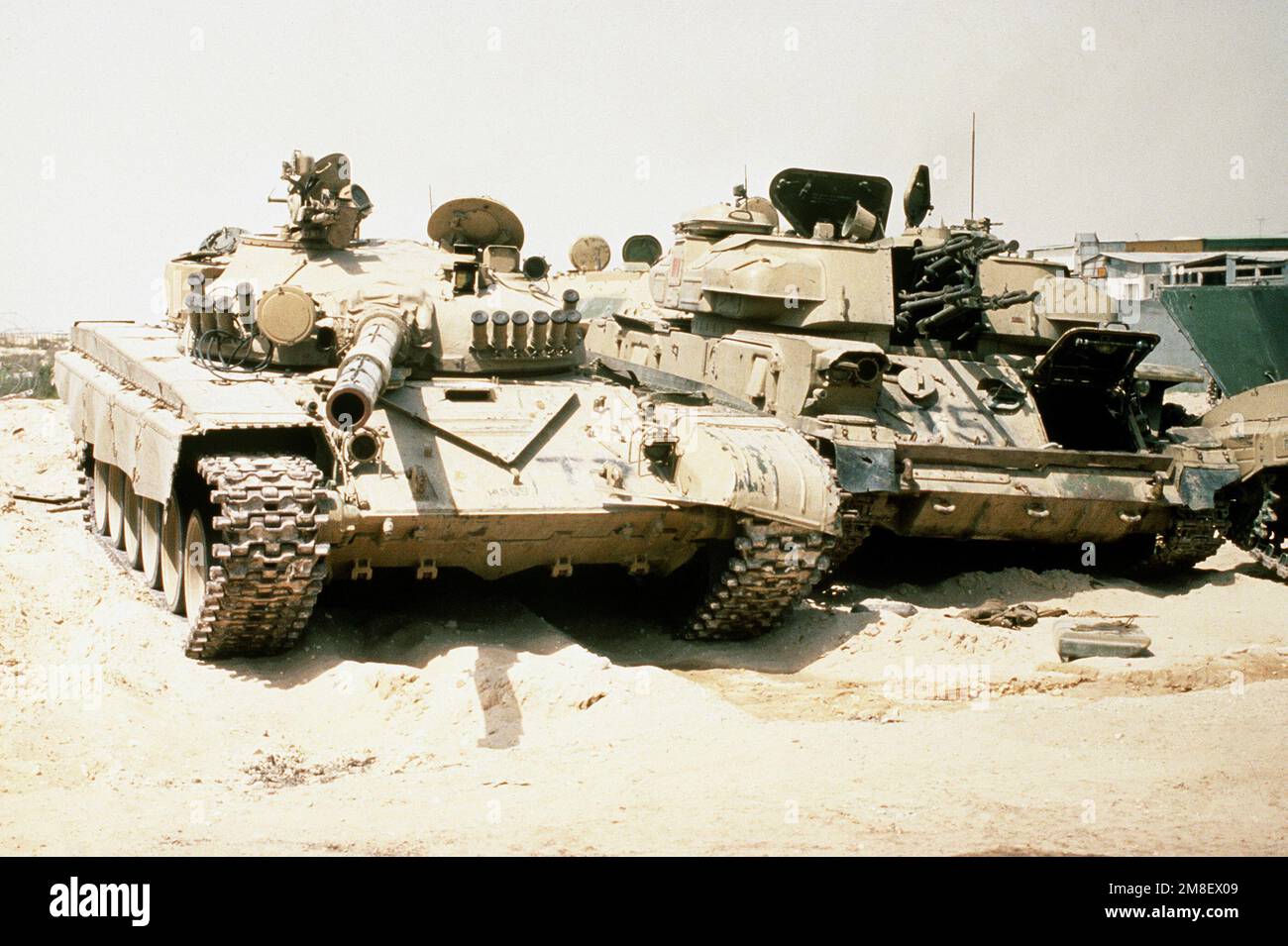 Iraqi vehicles ready to be transported out of the country include a T ...