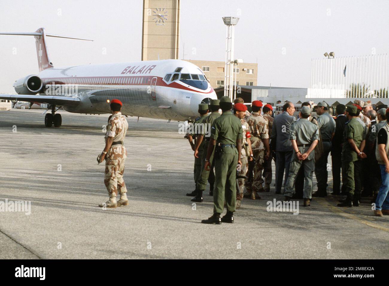 Coalition troops wait as an International Red Cross DC-9 aircraft from ...