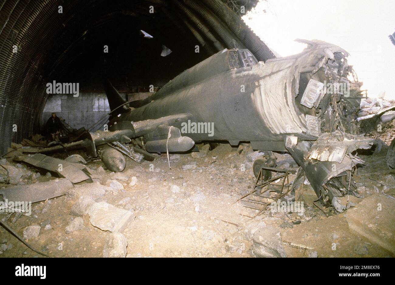 A view of the remains of an Iraqi Su-22 aircraft in a hangar destroyed ...