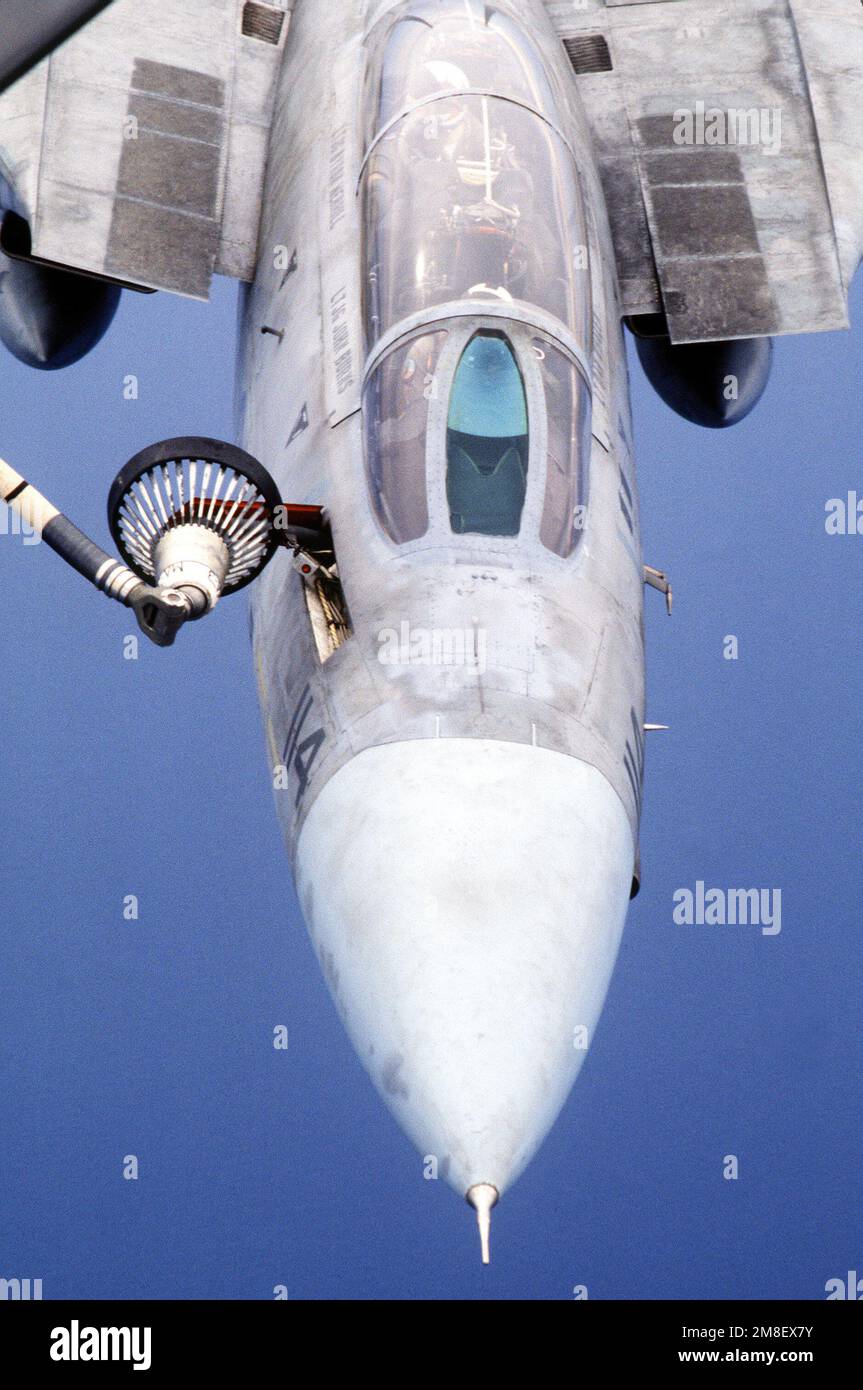 An F-14A Tomcat aircraft from Fighter Squadron 14 (VF-14) receives fuel ...