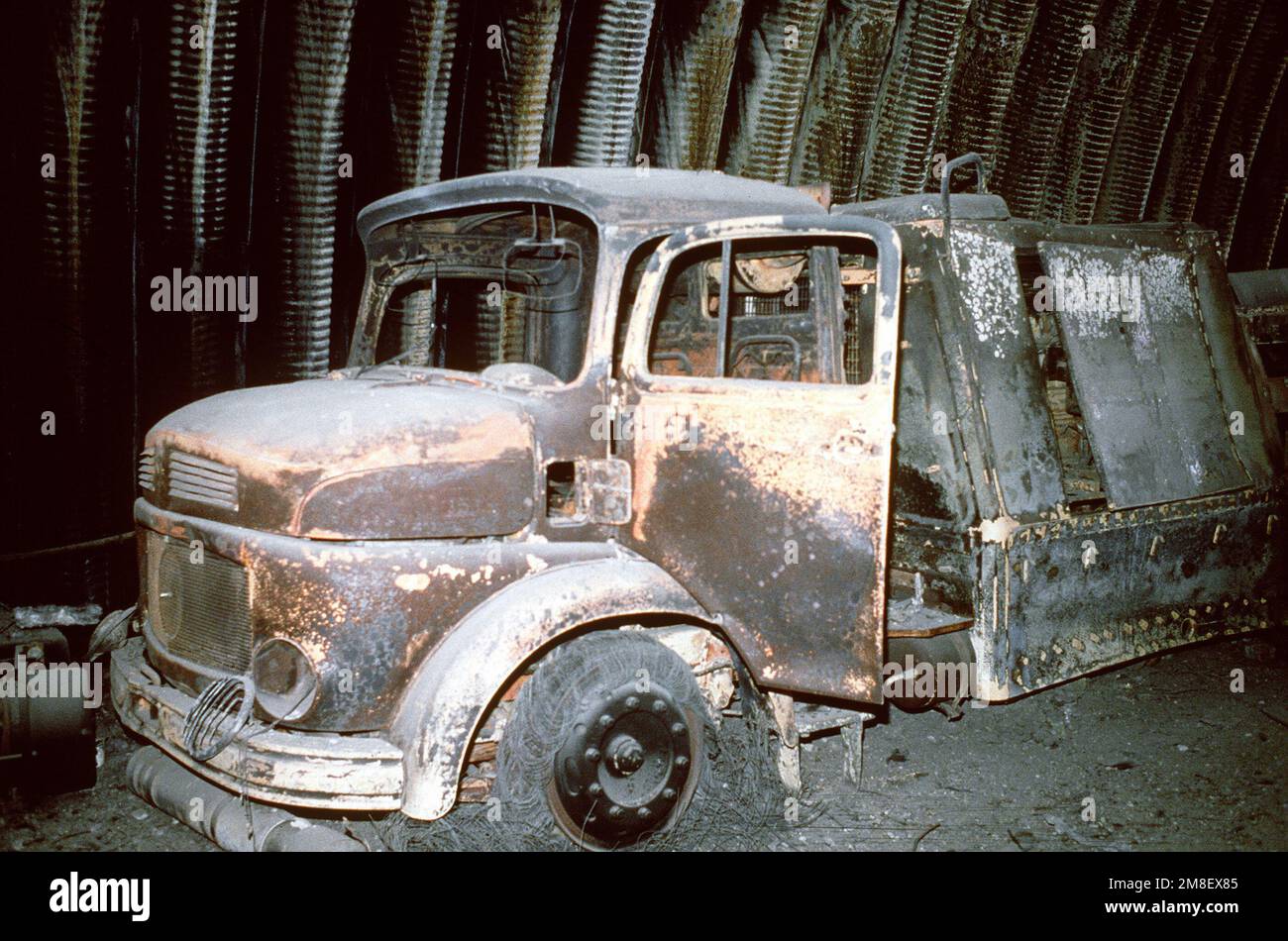 A view of a burned Iraqi truck in a hangar destroyed by Coalition ...