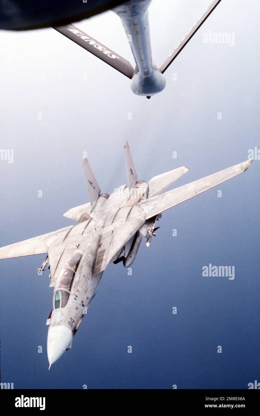 An F-14A Tomcat aircraft from Fighter Squadron 14 (VF-14) breaks away ...