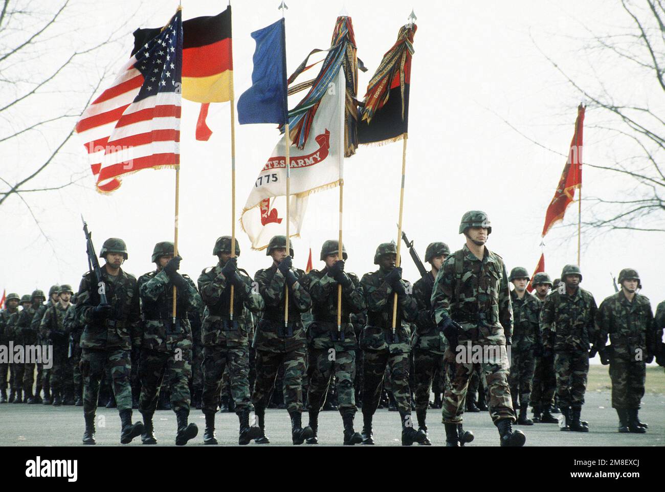 Members of the 1ST Infantry Division's color guard present the colors ...