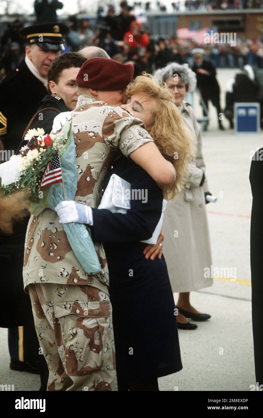 A former prisoner of war is reunited with his wife following his return ...