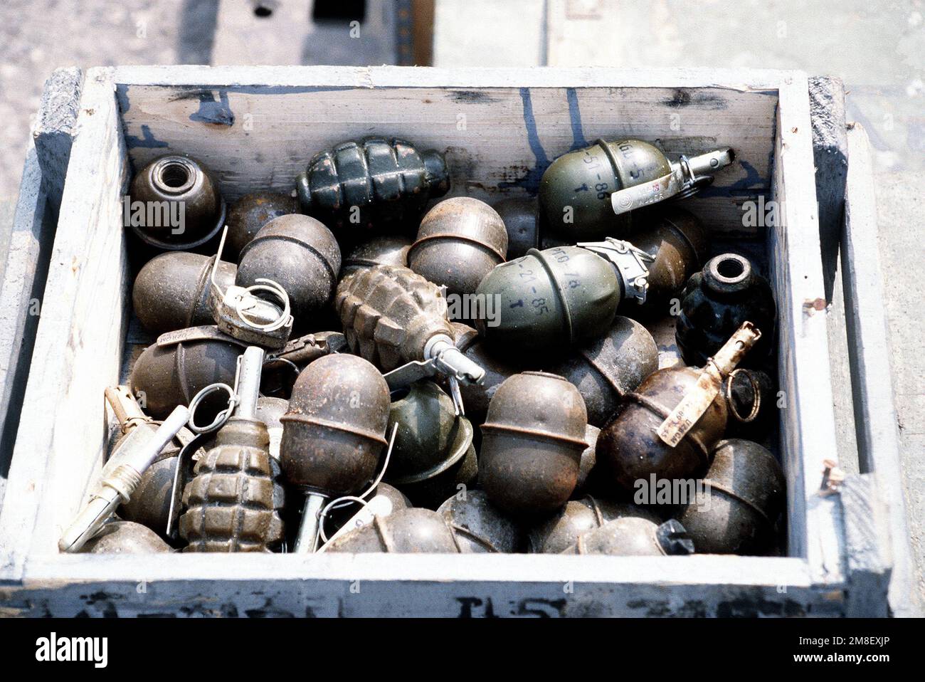 Iraqi RGD-5 and F-1 anti-personnel hand grenades fill a crate after ...