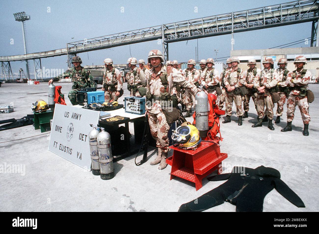 Members of a U.S. Army detachment pose for a photograph with some of ...