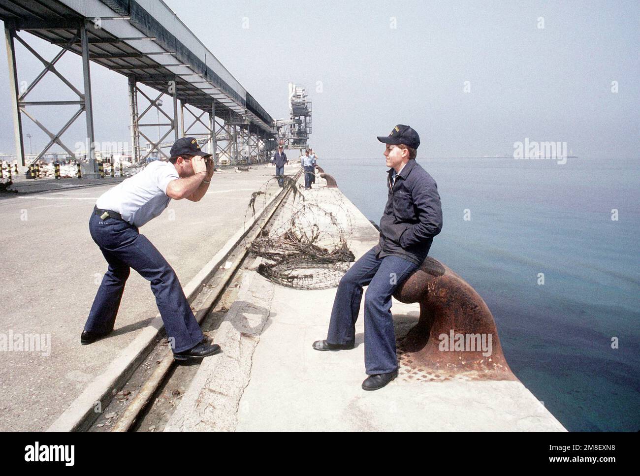 A sailor from the miscellaneous flagship USS LASALLE (AGF-3), docked at ...