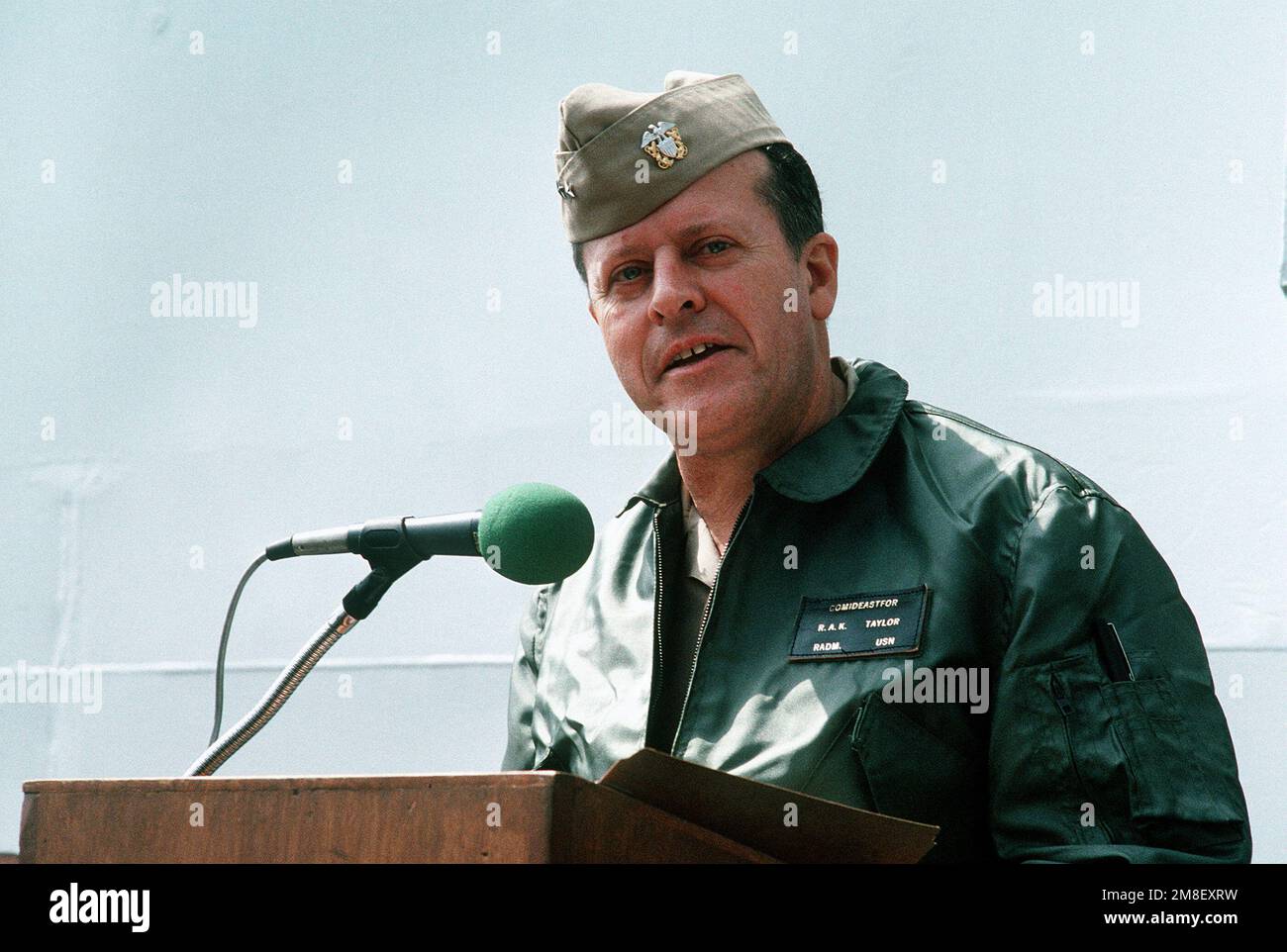Rear Adm. Raynor A.K. Taylor, commander, Middle East Force, speaks at a ...