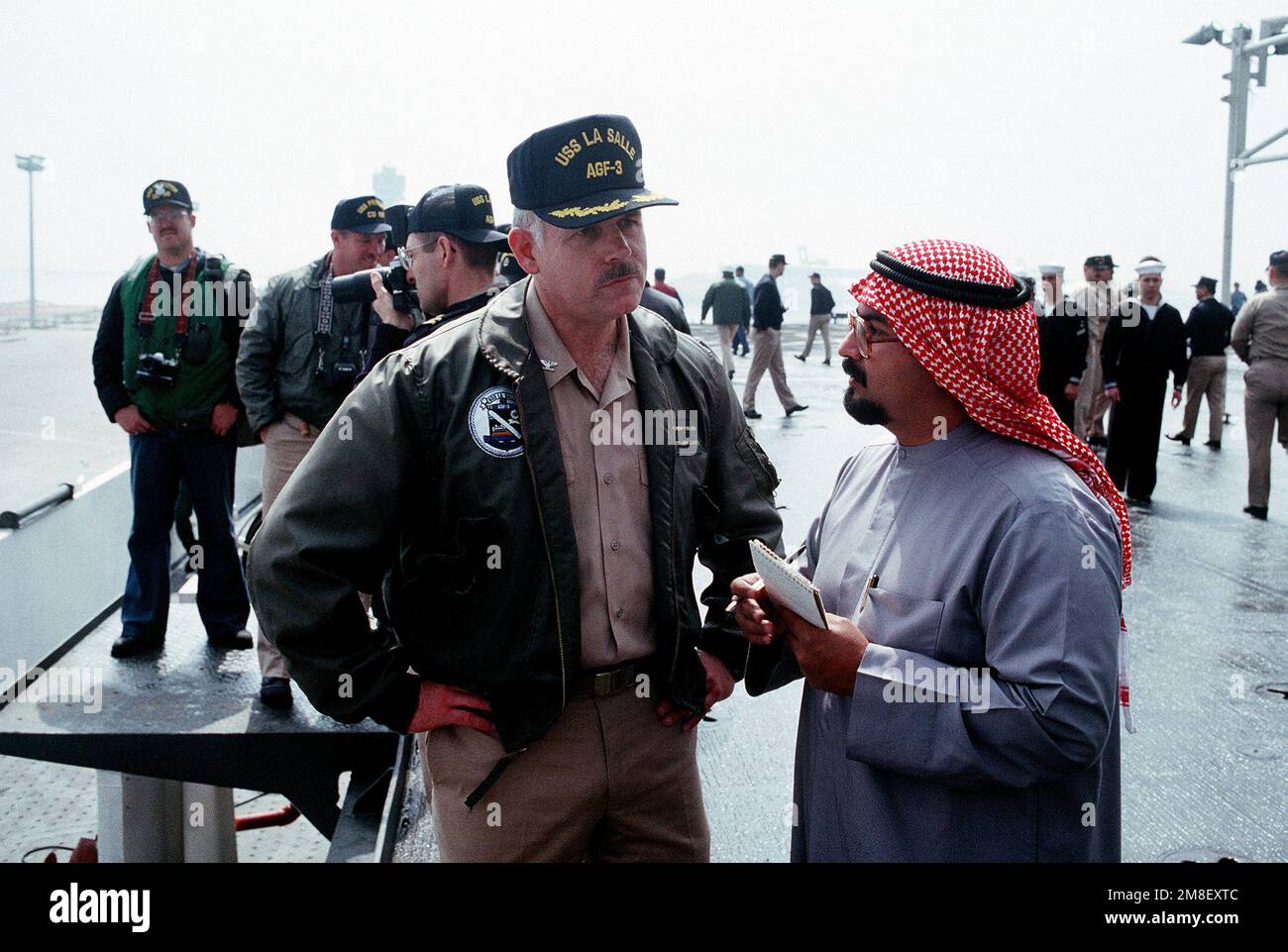 A Kuwaiti media representative interviews an officer from the command ...