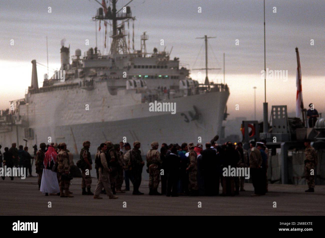 Military personnel and civil officials from several coalition nations ...