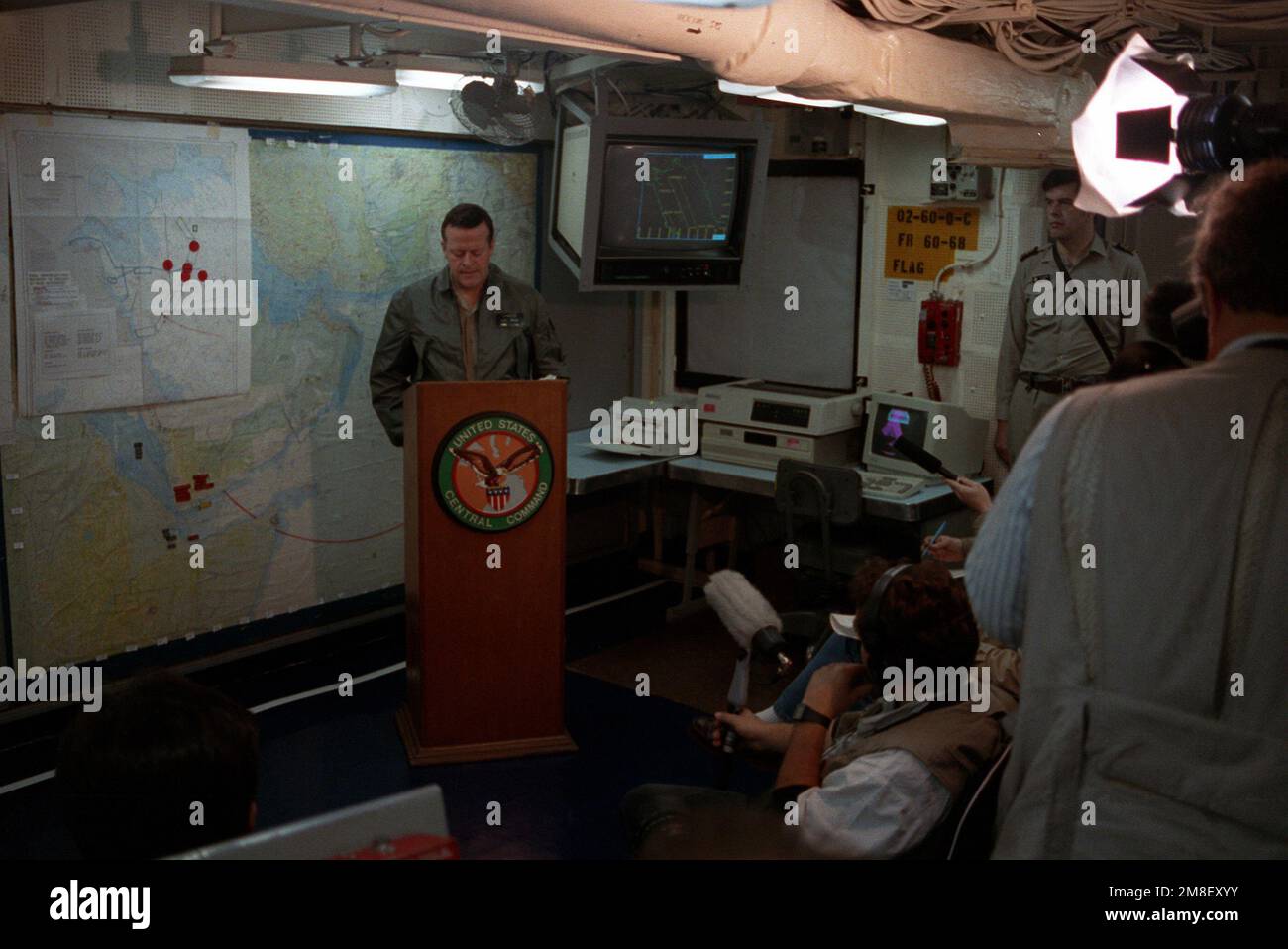 Rear Adm. Raynor A.K. Taylor, commander, Middle East Force, conducts a ...