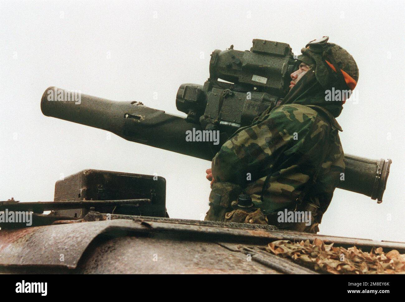 A soldier from 2nd Infantry Division, Orange team, aims a Tube-launched ...