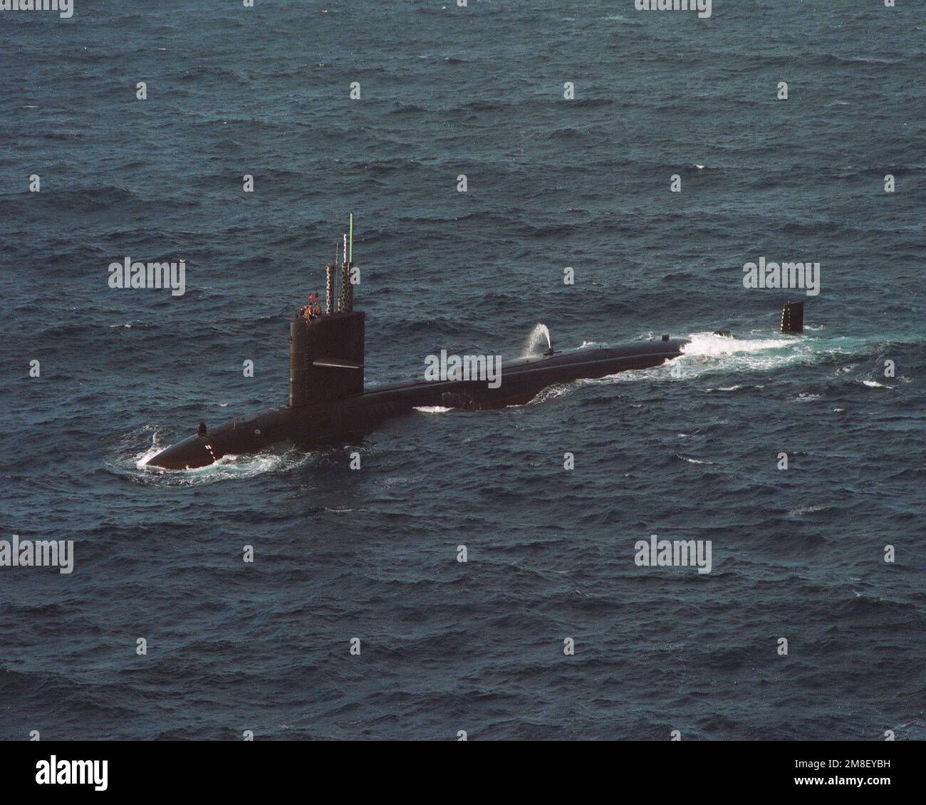 A port bow view of a Sturgeon-class submarine underway on the surface ...