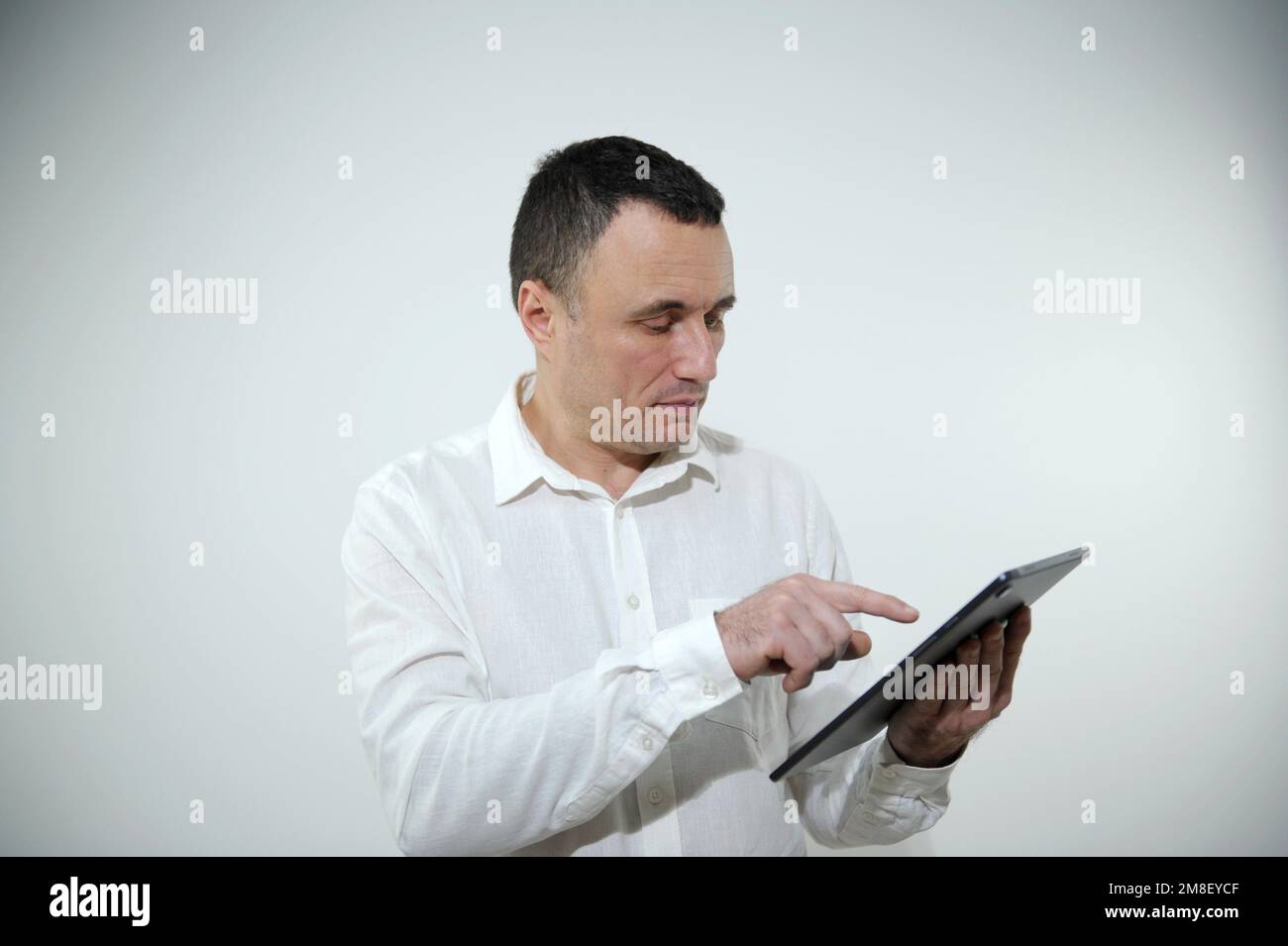 Smiling Middle Eastern Man With Digital Tablet In Hands Successful ...