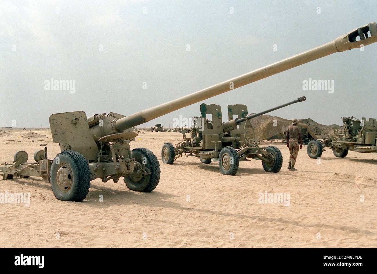 A left front view of a Type 59 130mm field gun, and an Iraqi S-60 57mm ...