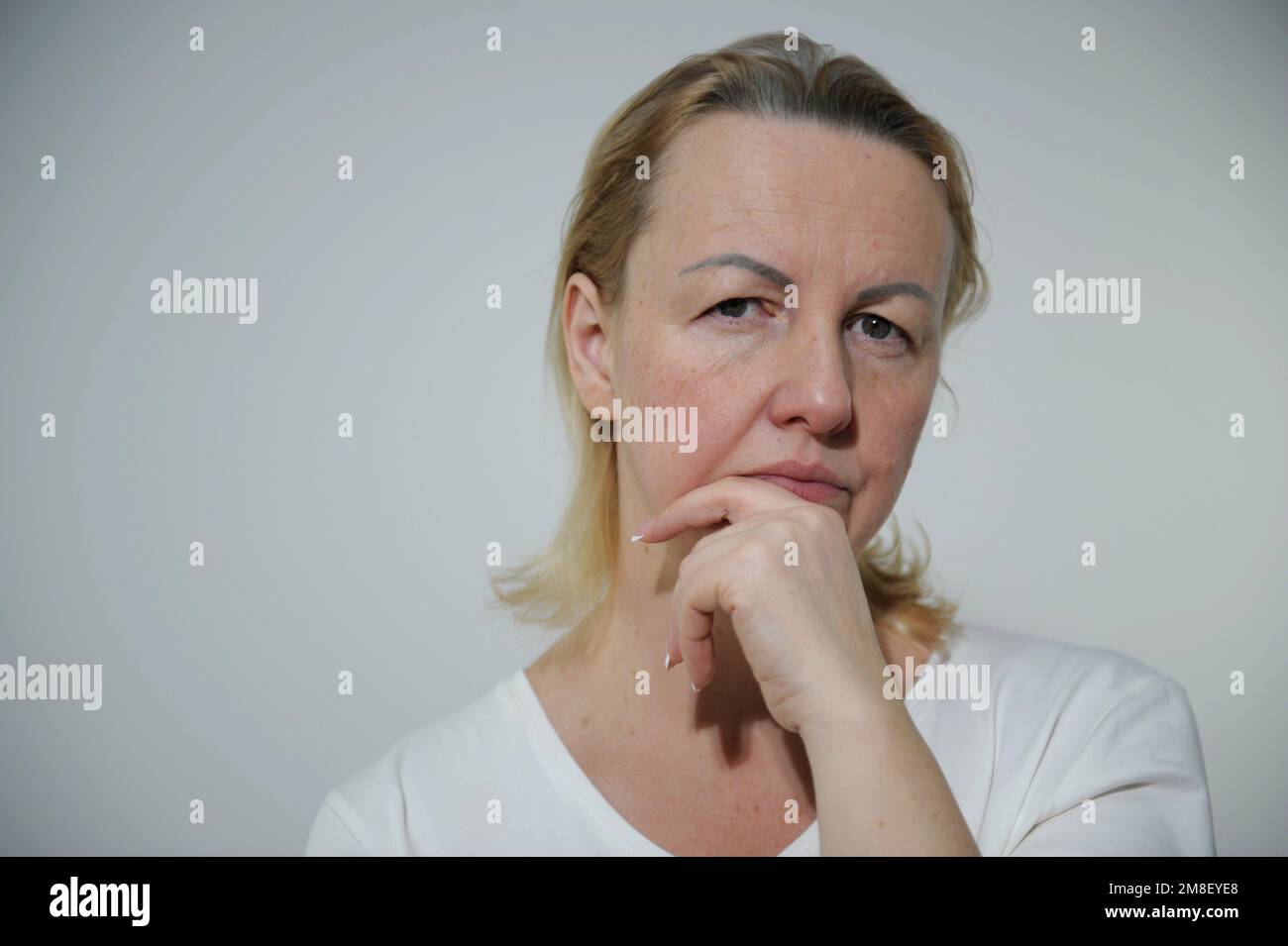 sad and calm look of a simple real woman unpainted hair need self-care ...