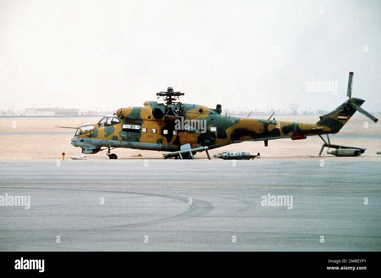 A captured Iraqi MIL Mi-24 Hind helicopter stands at an XVIII Airborne ...