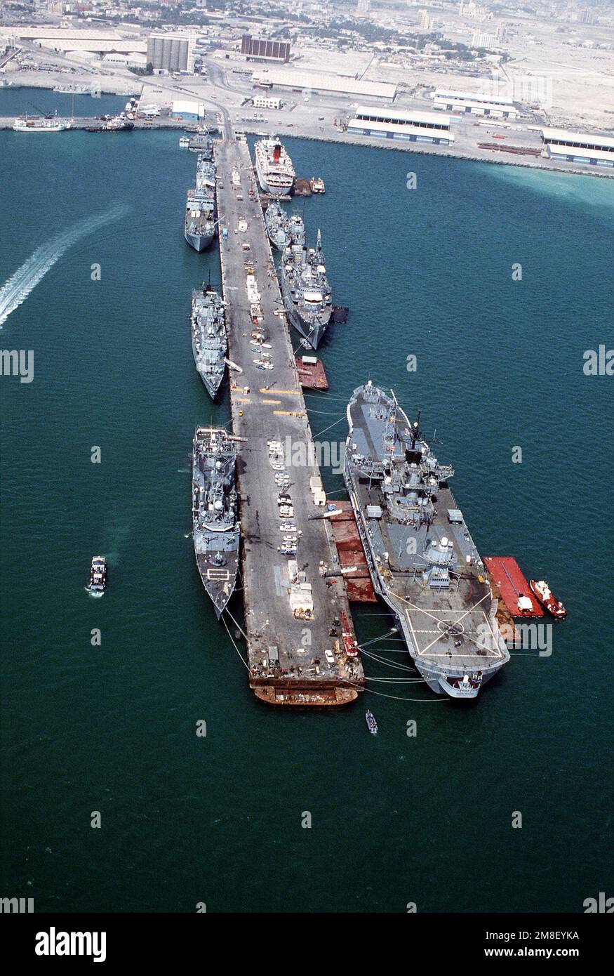 The amphibious command ship USS BLUE RIDGE (LCC-19), right foreground ...