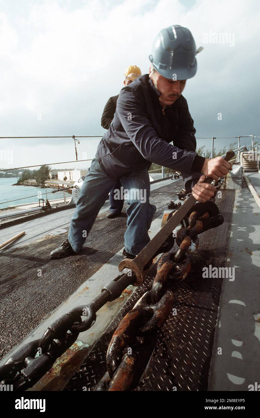 A deck hand aboard the guided missile destroyer USS MACDONOUGH (DDG-39 ...