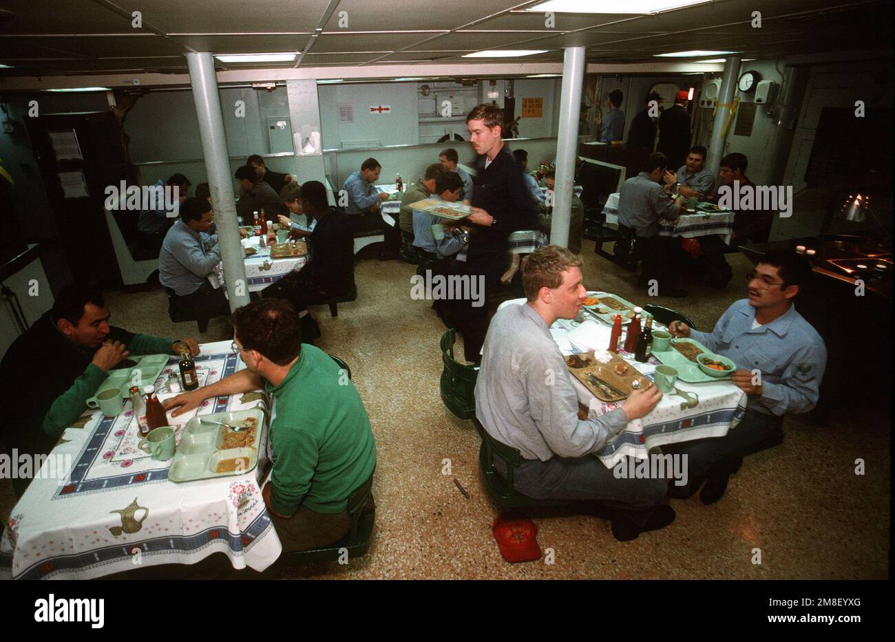 Crewmen aboard the guided missile frigate USS NICHOLAS (FFG-47) eat ...
