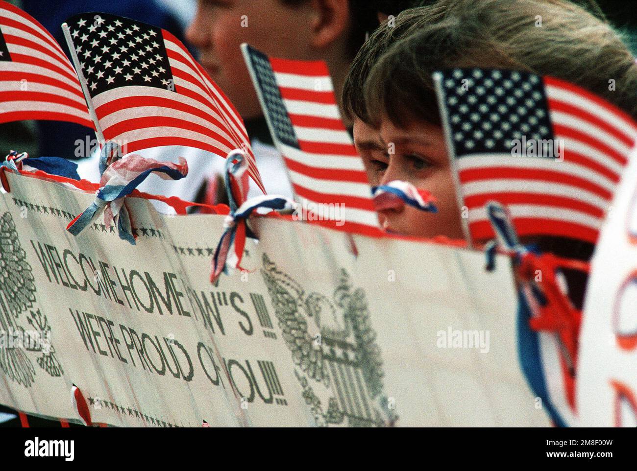A little girl looks over a banner during a ceremony for LT. Robert ...