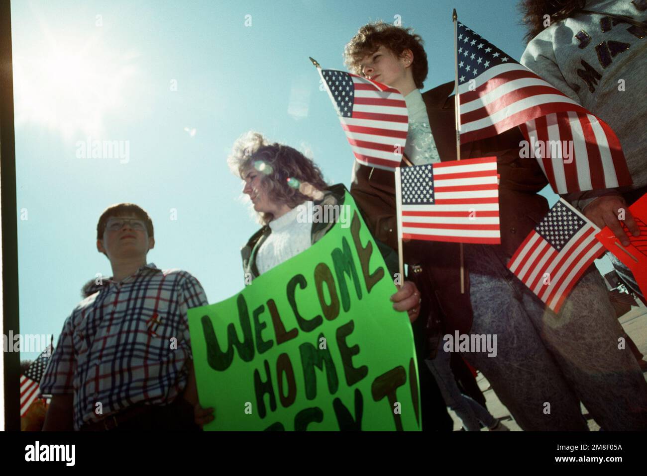 A crowd waits to greet members of Beachmaster Unit 2 upon their return ...
