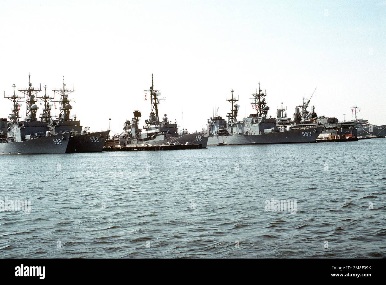 A view of some of the ships tied up at the naval station. The ships are ...